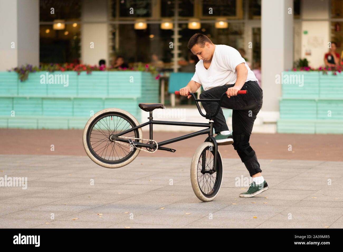The guy on the stunt bike does the twist of the wheel and does the ...
