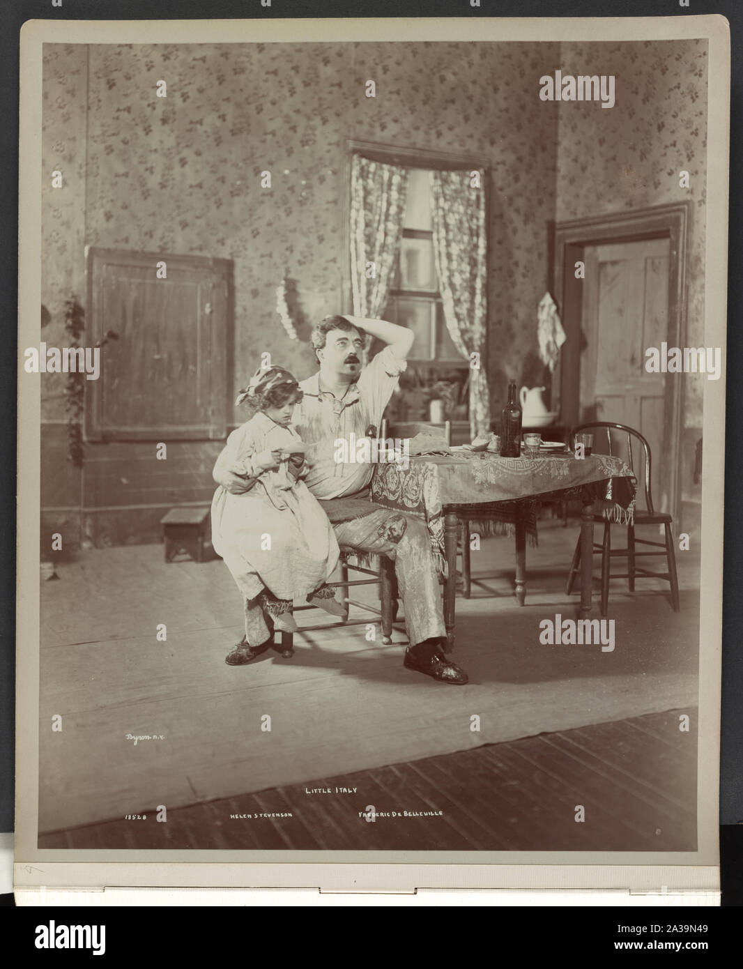 Scene from Little Italy showing child actress Helen Stevenson sitting ...