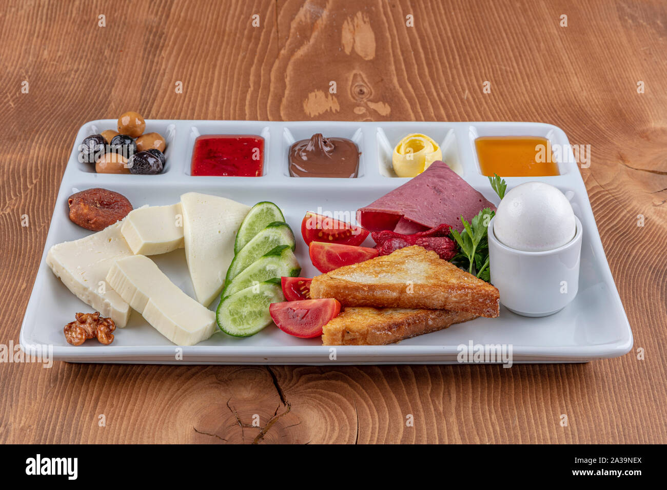 Healthy Turkish style breakfast plate on wooden table in restaurant ...