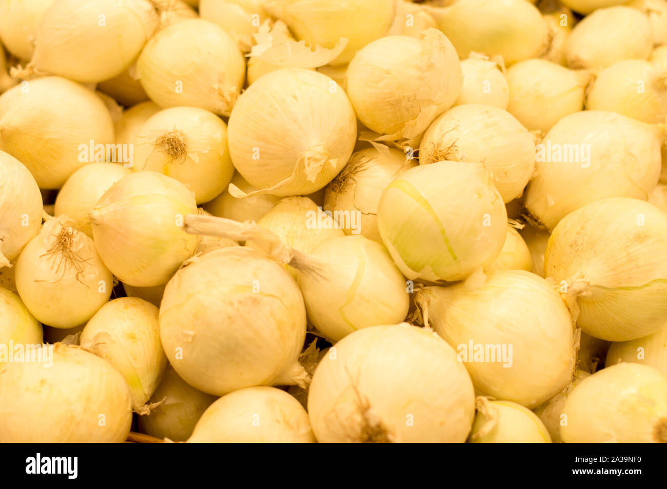 White onion is for sale on the storefront. Close-up Stock Photo - Alamy