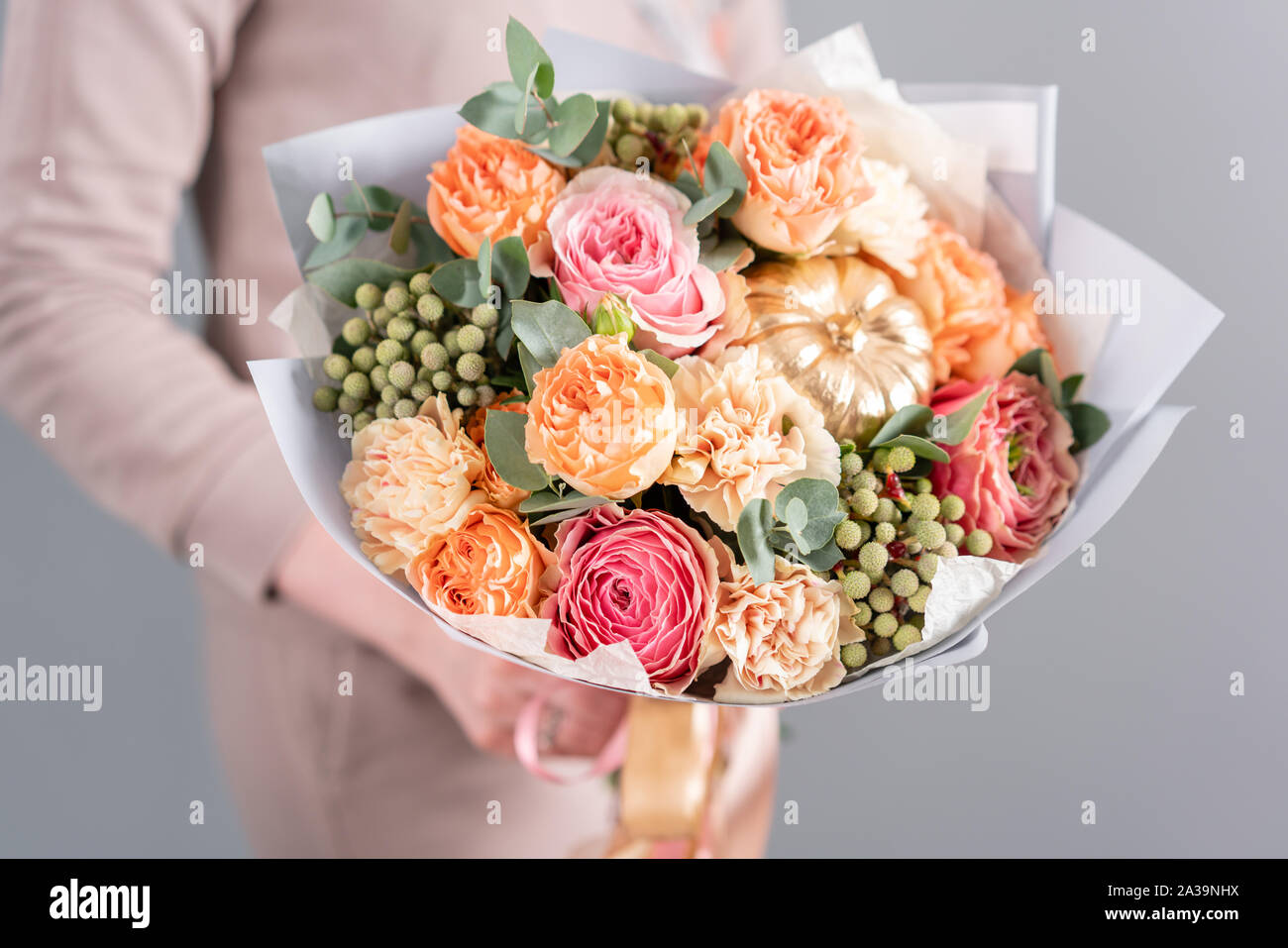 Bouquet Peach and orange color. Beautiful bunch mixed flowers in womans ...