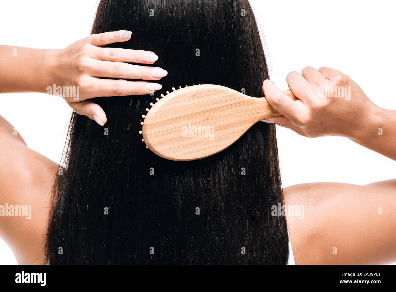 back view of brunette beautiful woman brushing long straight healthy ...
