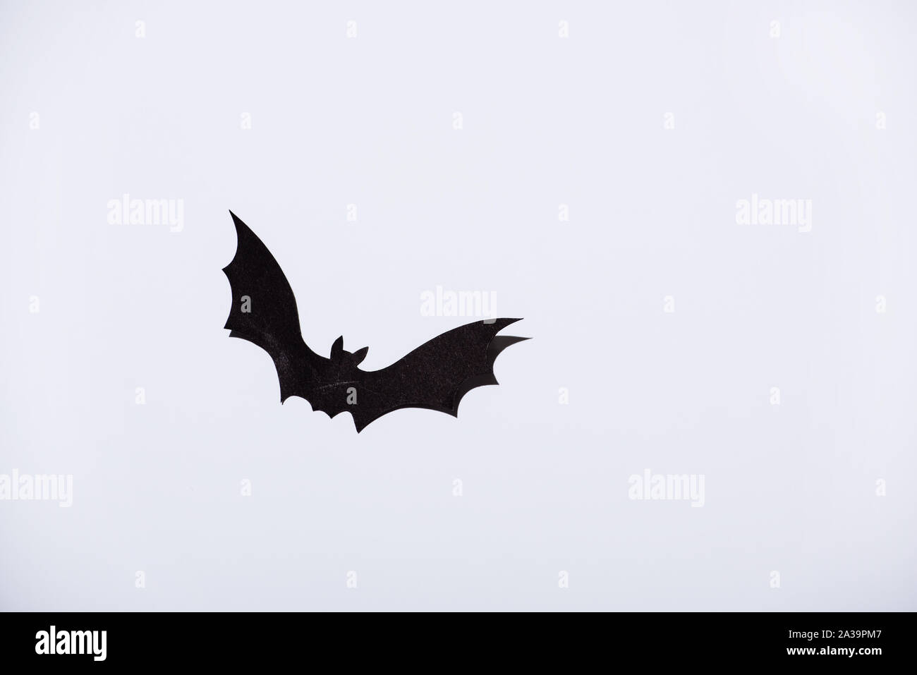 black paper bat on white background Stock Photo - Alamy