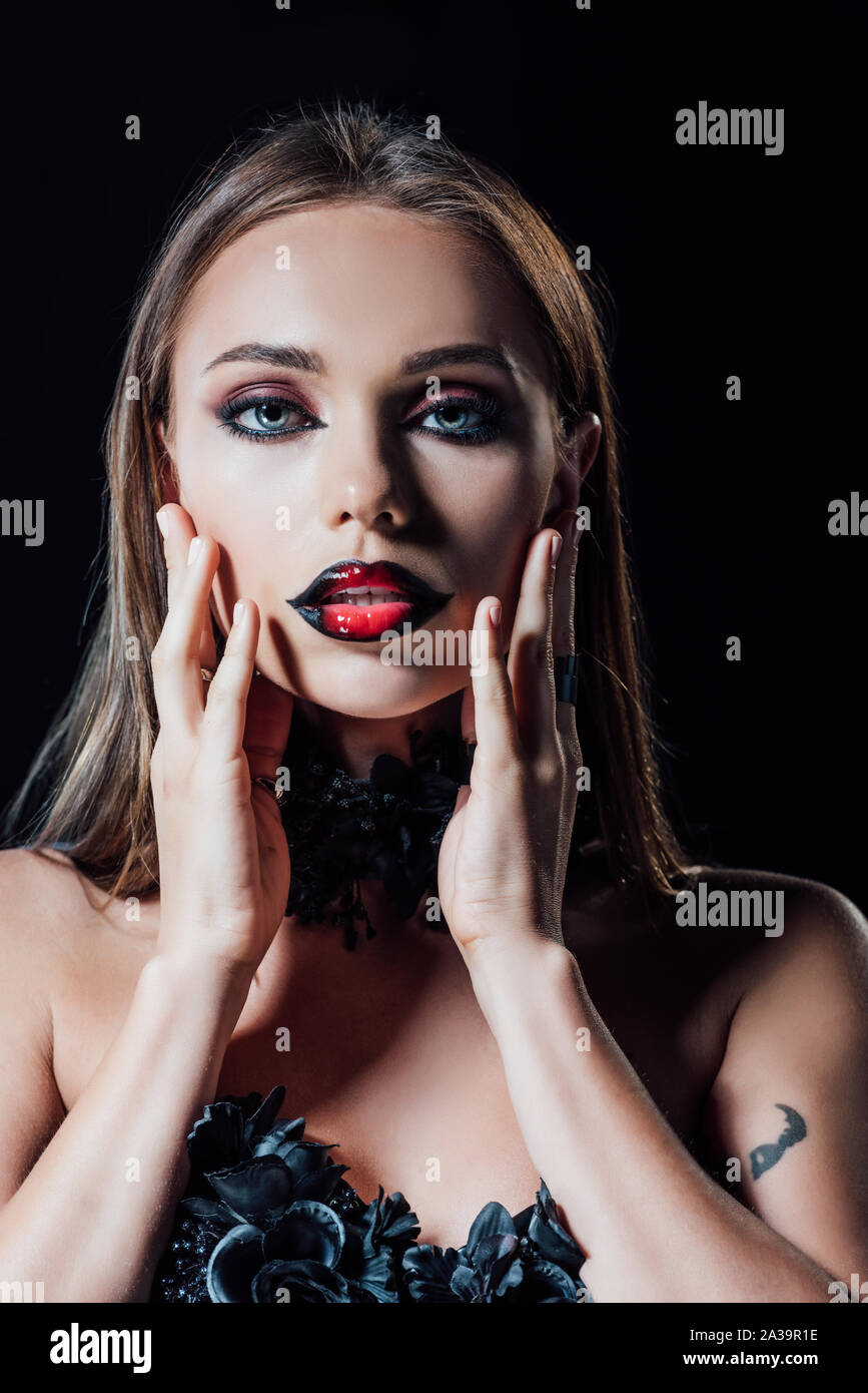 scary vampire girl in black gothic dress touching face isolated on ...
