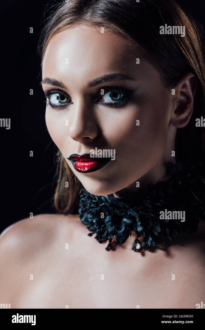 portrait of scary vampire girl in black gothic dress isolated on black ...