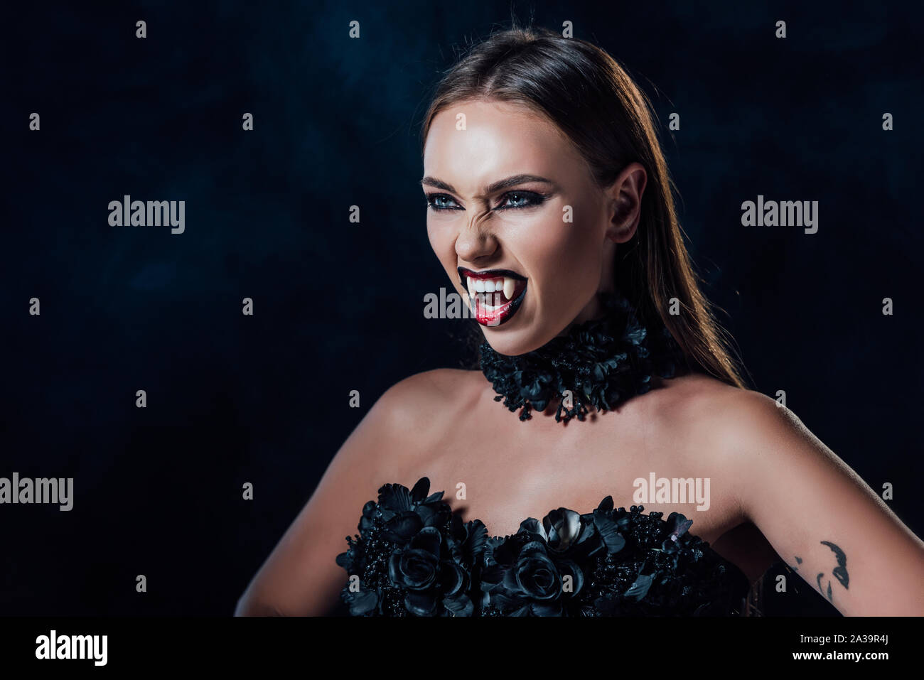 Woman in costume with fangs hi-res stock photography and images - Alamy