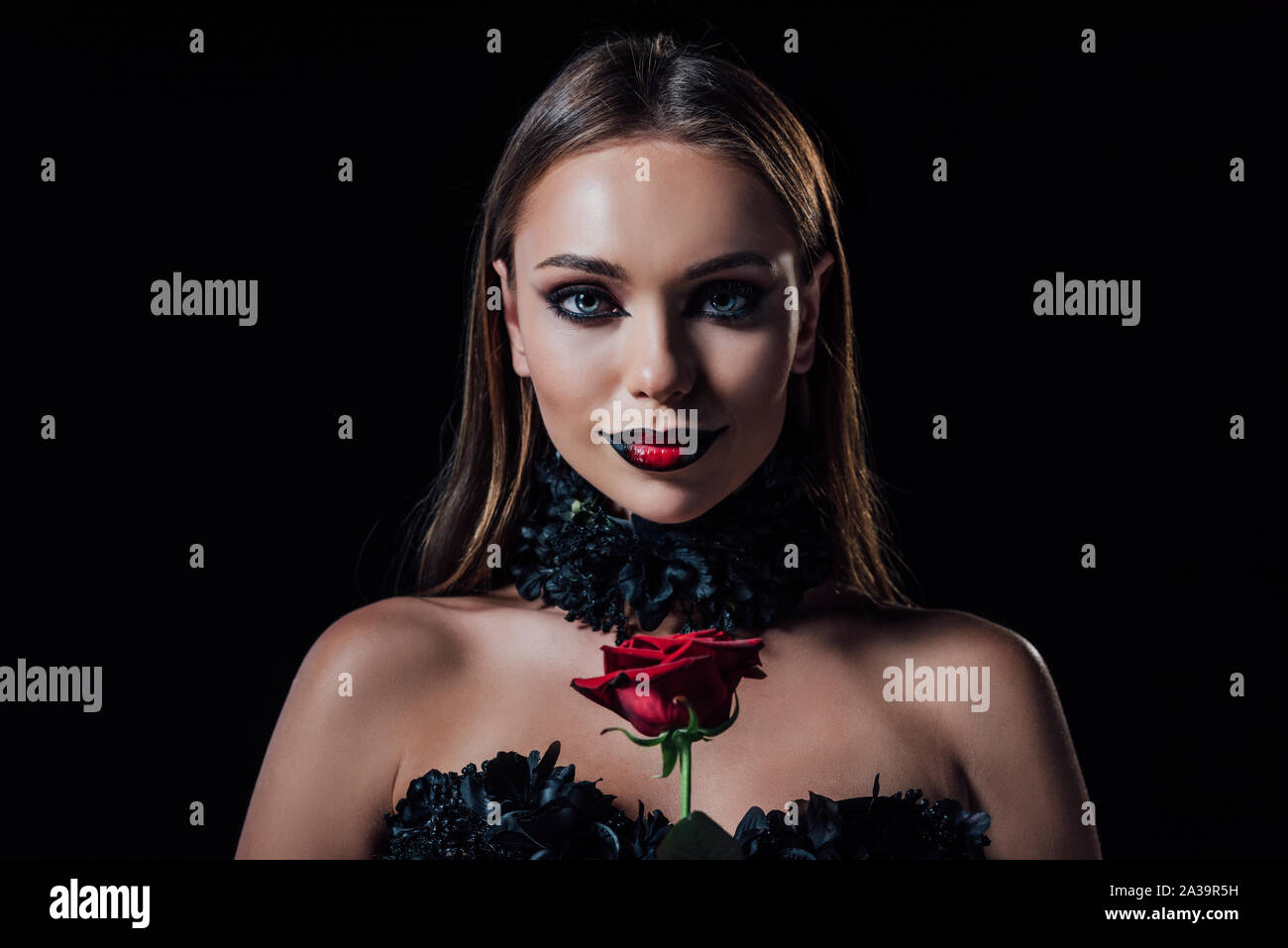 Gothic girl holding black rose hi-res stock photography and images - Alamy