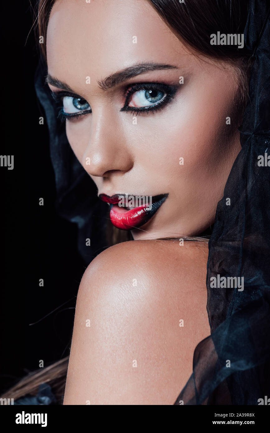 vampire girl in black gothic dress and veil isolated on black Stock ...