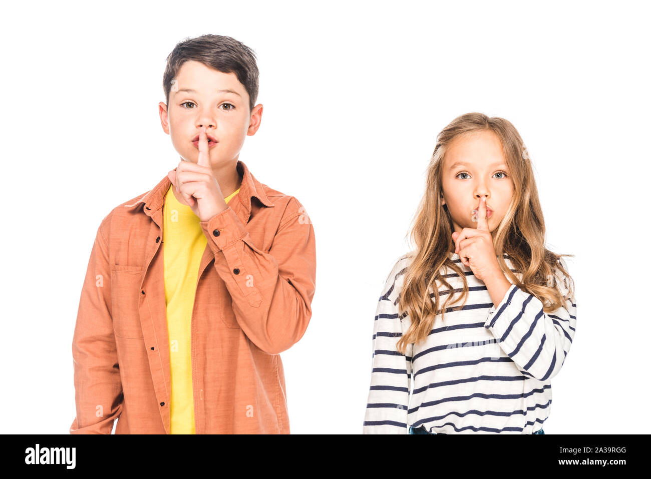 front view of two kids showing hush signs isolated on white Stock Photo ...