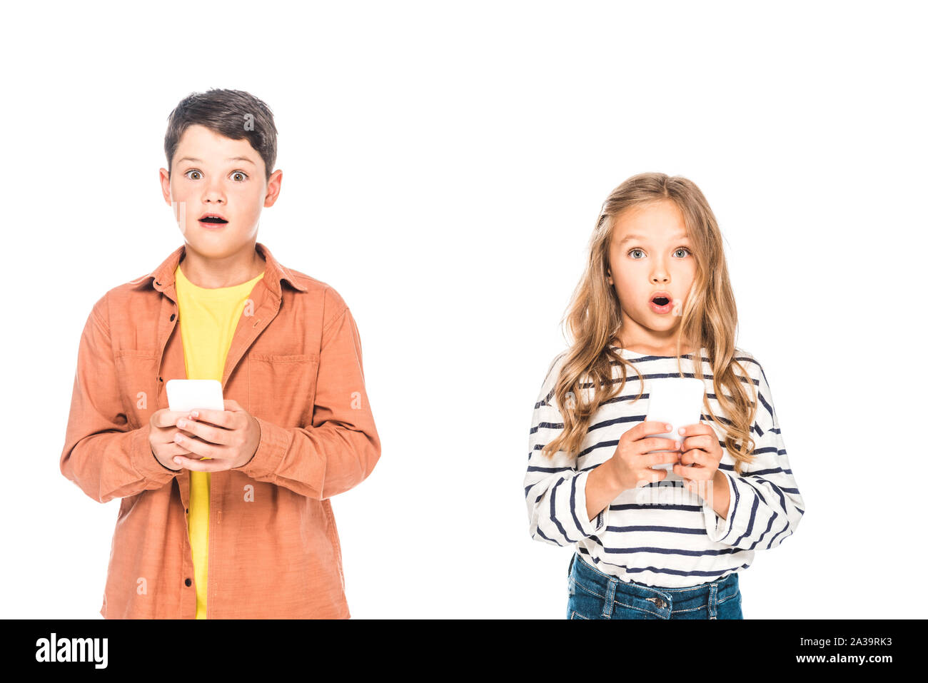 front view of shocked children using smartphones isolated on white ...