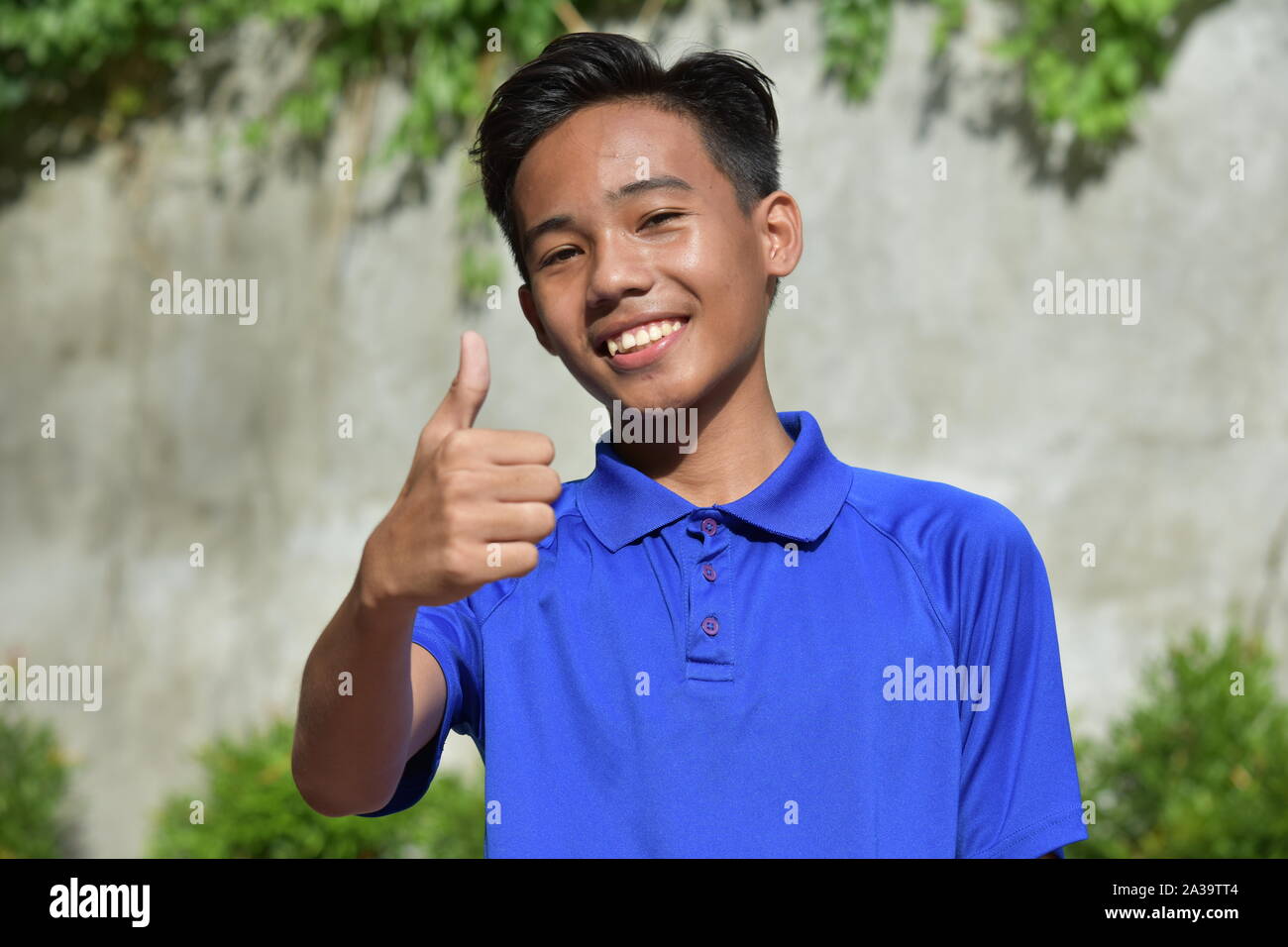 A Filipino Youth With Thumbs Up Stock Photo - Alamy