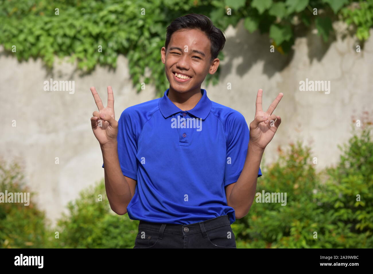 A Youngster And Peace Sign Stock Photo - Alamy