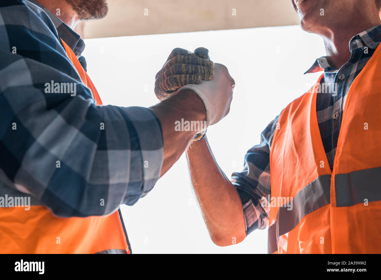 Builders hands together hi-res stock photography and images - Alamy