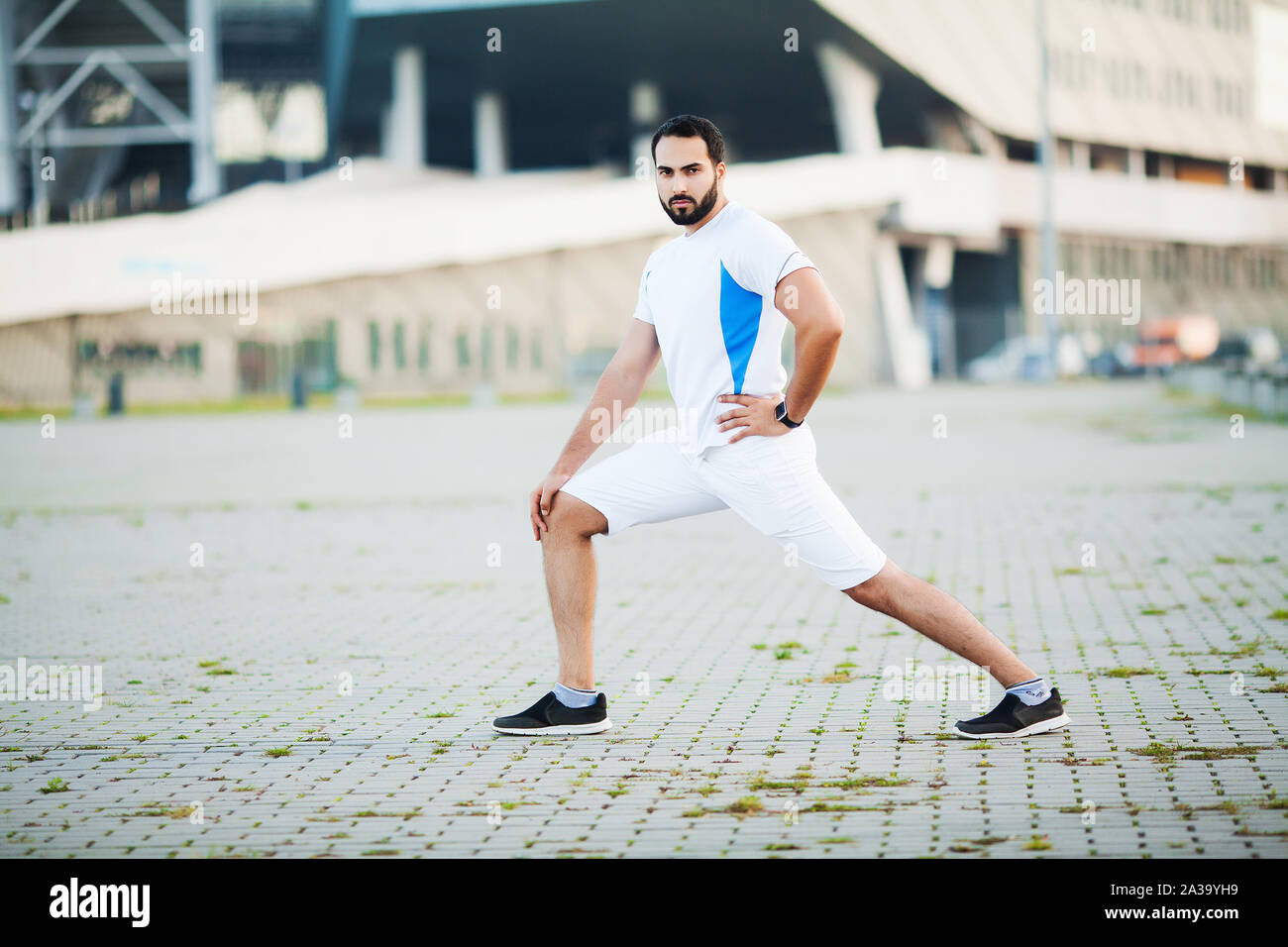 Fitness. Young man running in urban environment Stock Photo - Alamy