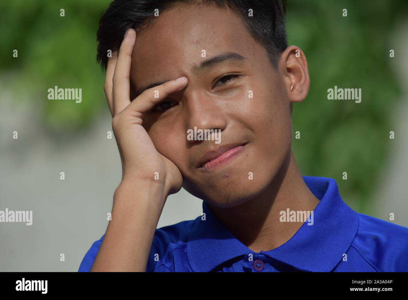 An A Worried Filipino Boy Stock Photo - Alamy