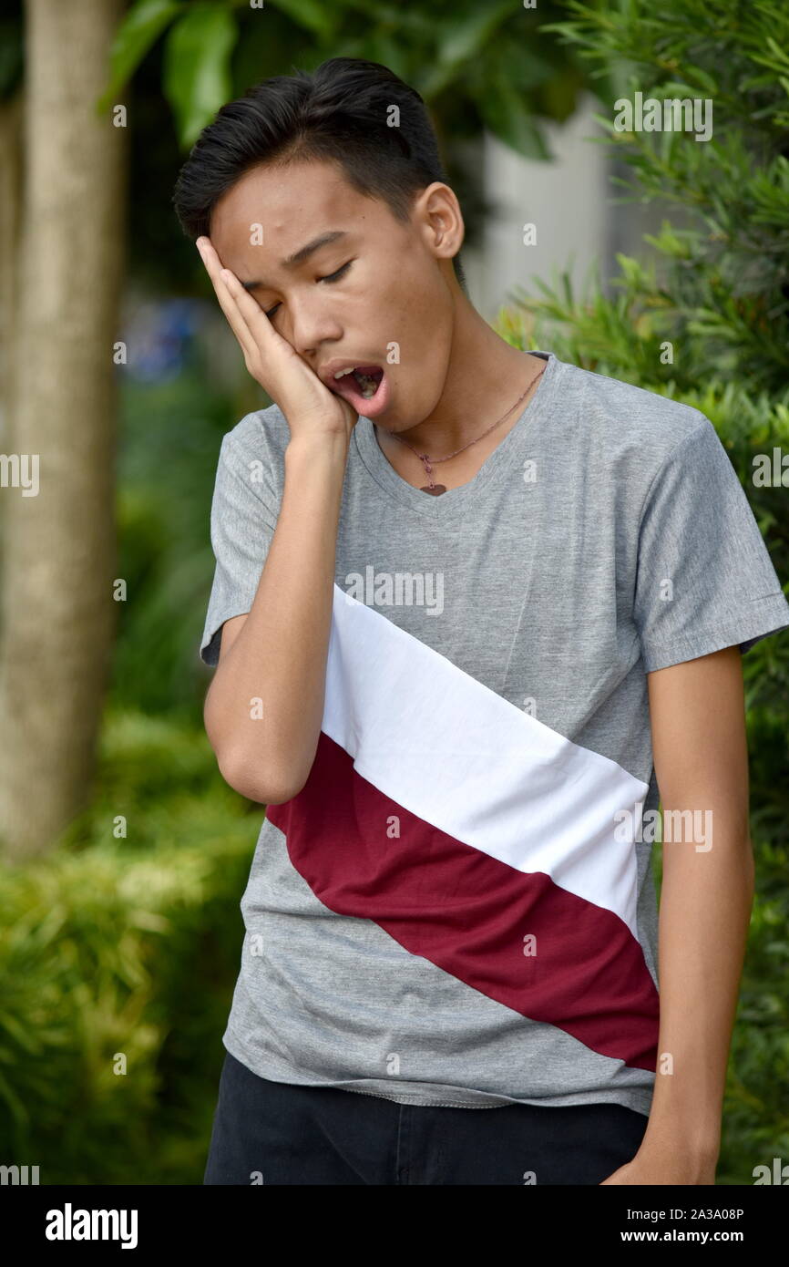 An A Yawning Minority Male Stock Photo - Alamy
