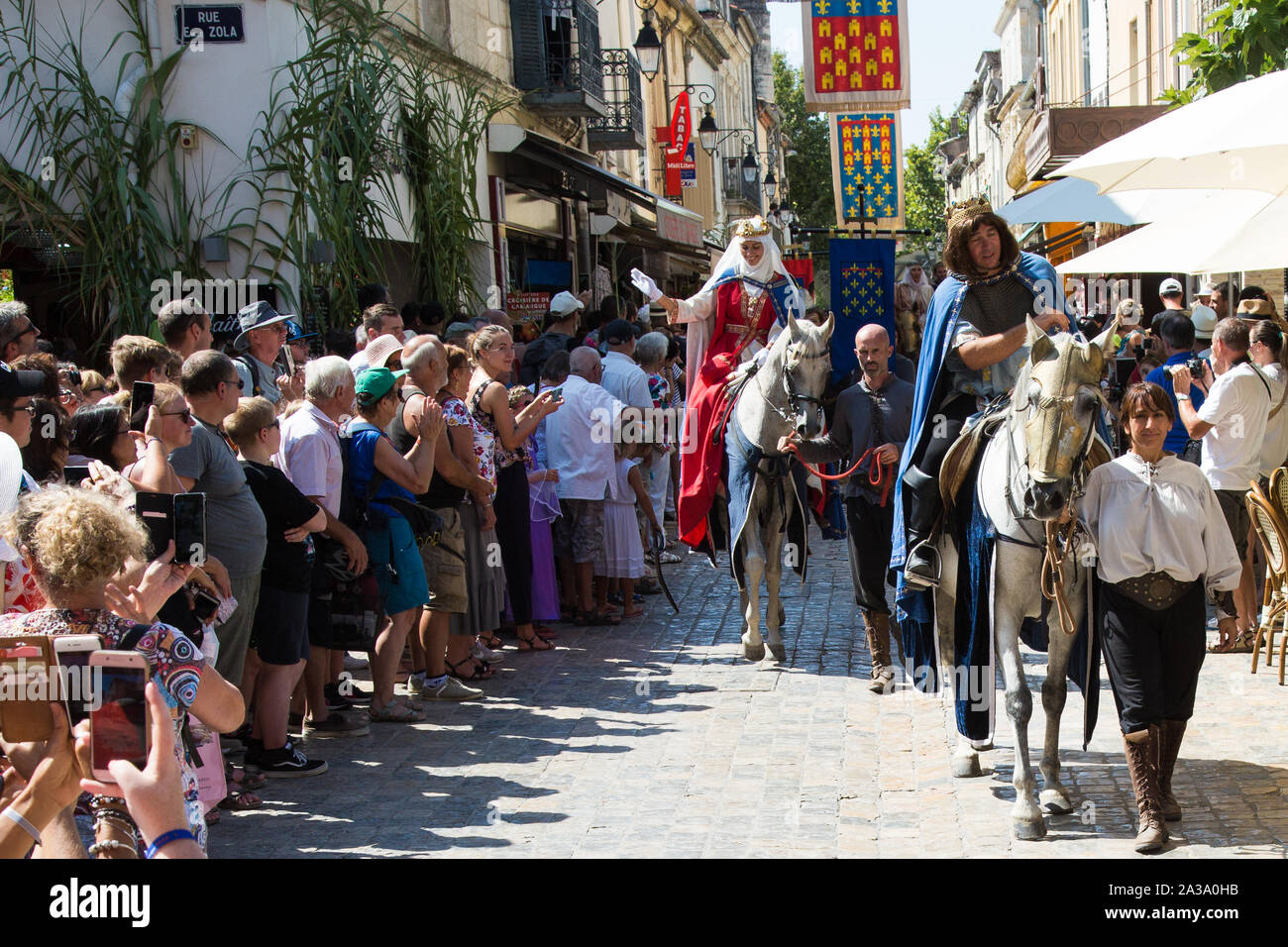 Aigues-Mortes, France. 24 August, 2019. A crowd of people watches a ...