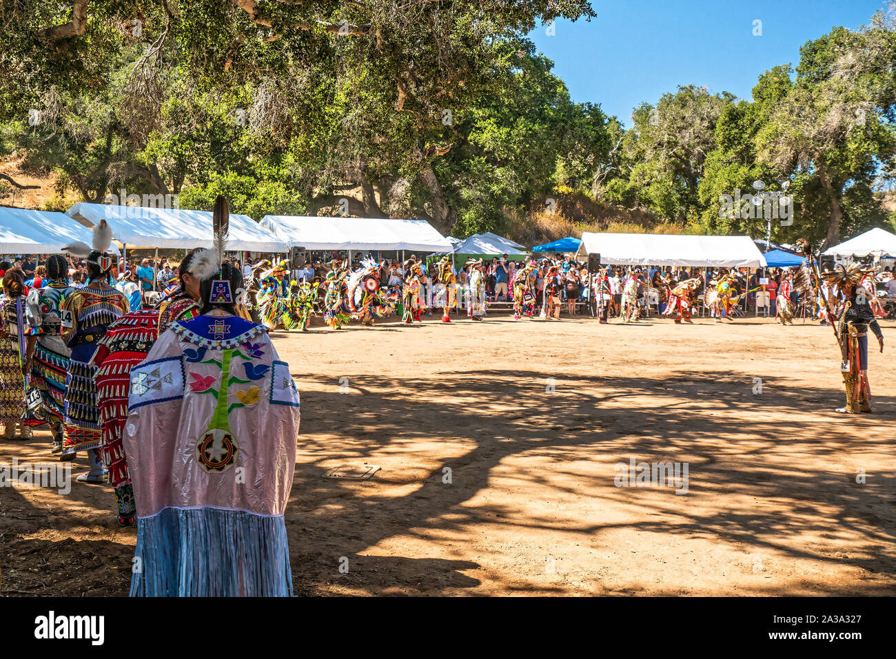 Pow Wow. Grand Entry. Native Americans in full regalia moving in circle ...