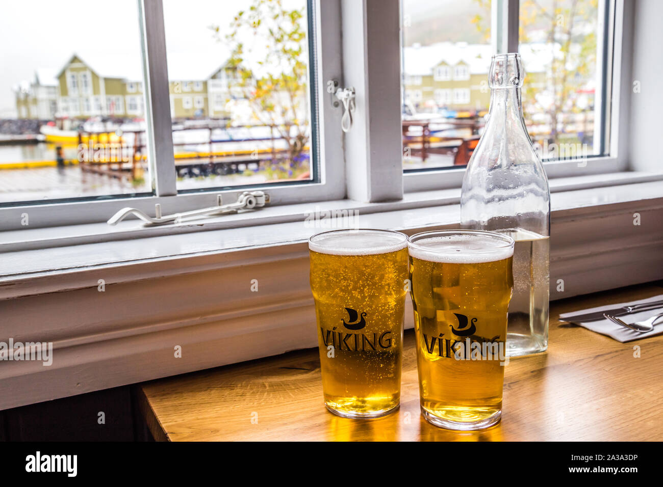 Two viking beers with a view of the marina in Siglufjordur, Iceland ...