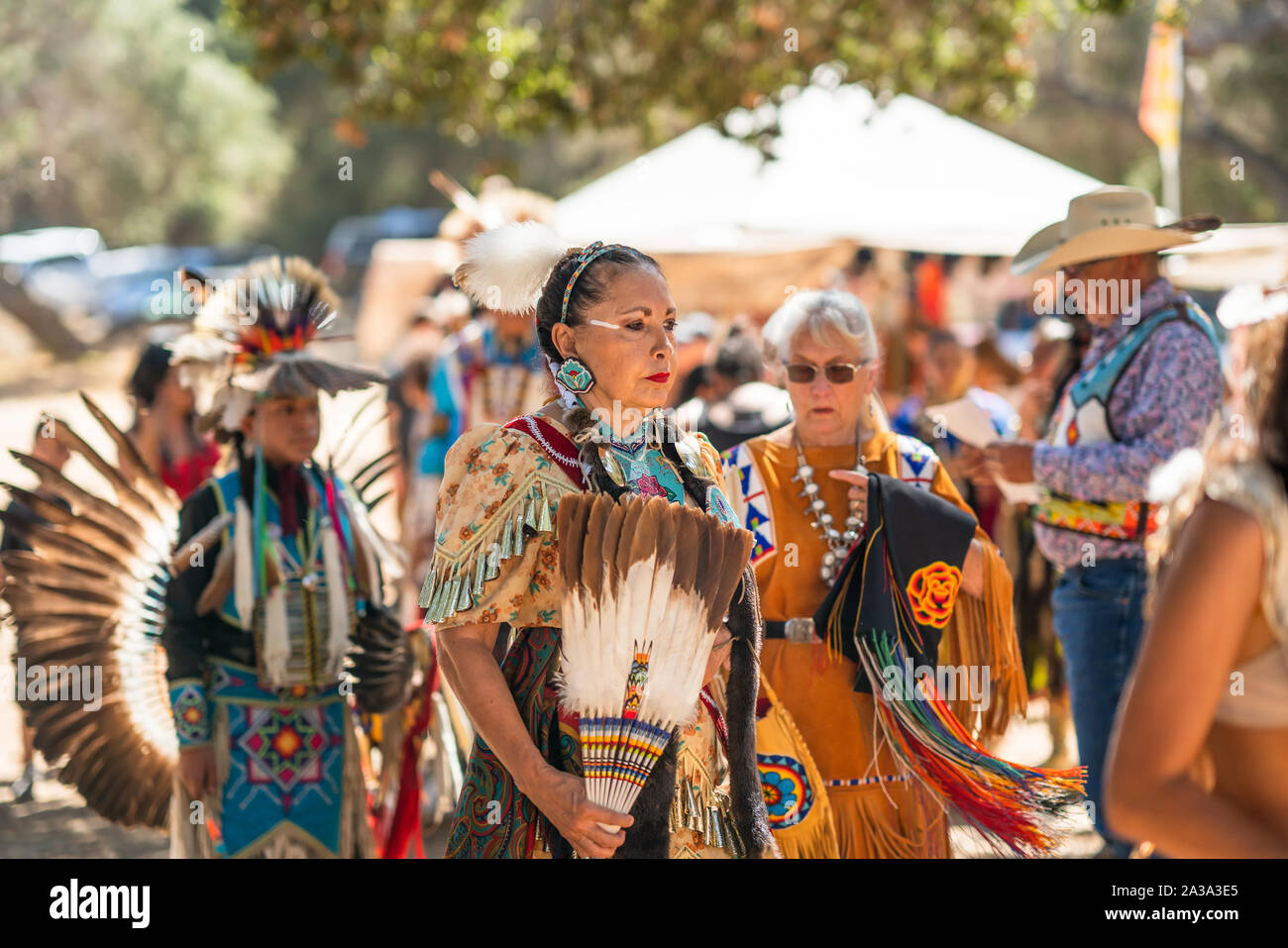 Pow Wow. Grand Entry. Native Americans in full regalia moving in circle ...