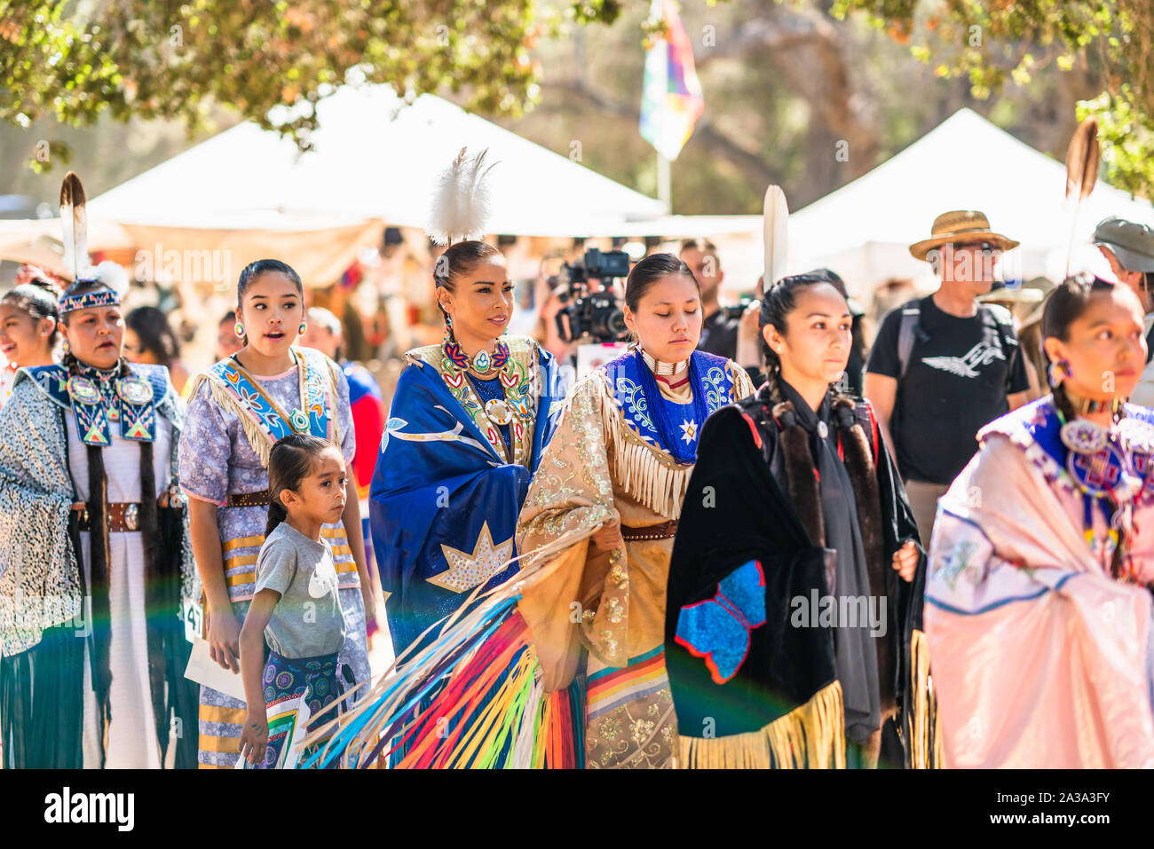 Pow Wow. Grand Entry. Native Americans in full regalia moving in circle ...