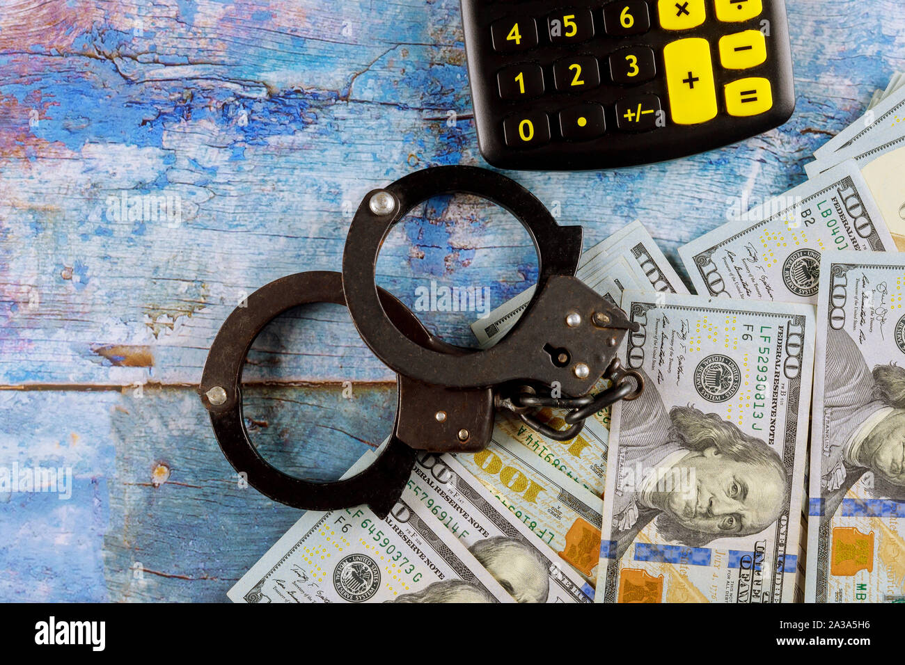 Crime accounting financial with calculator and police handcuffs on ...