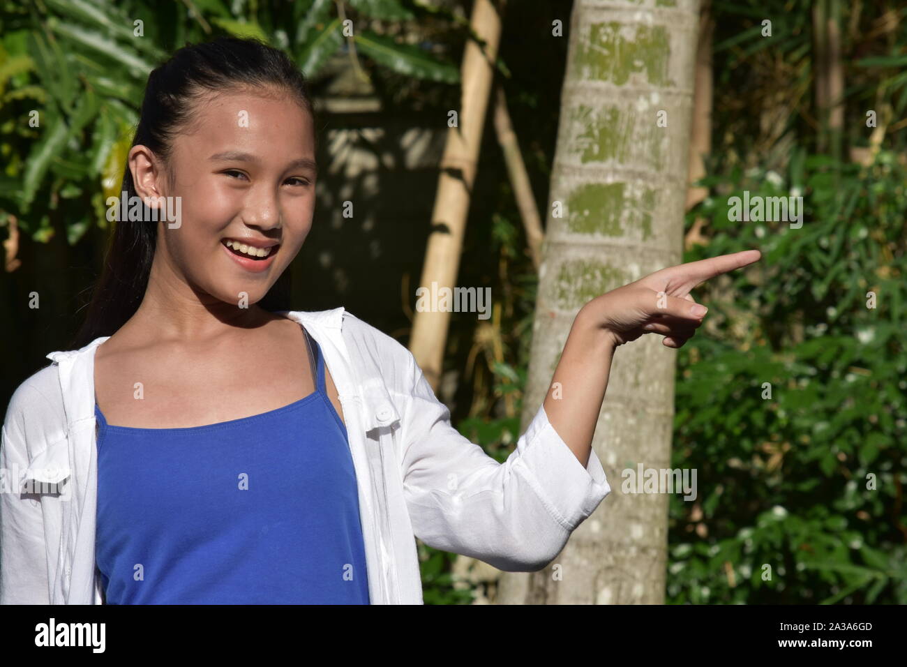 A Beautiful Filipina Female Pointing Stock Photo - Alamy
