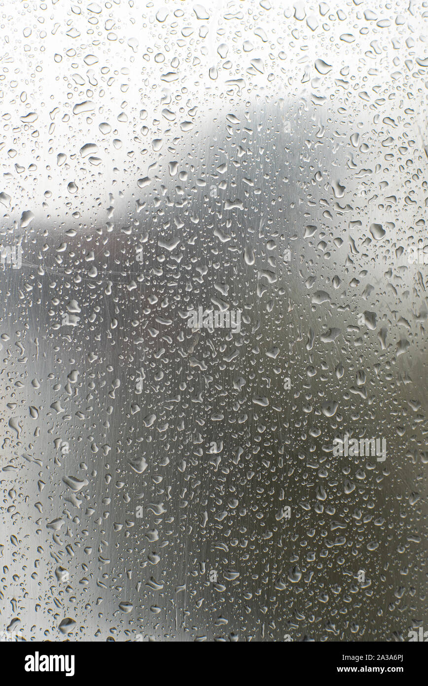 Shiny, metallic background, covered with water drops. Texture of water ...