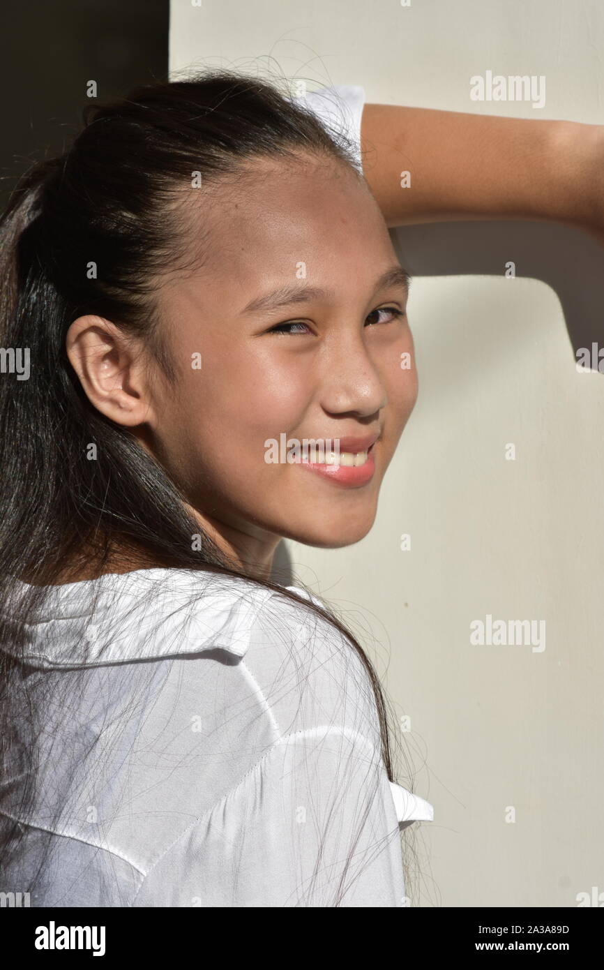 A Smiling Minority Teenager Girl Stock Photo - Alamy