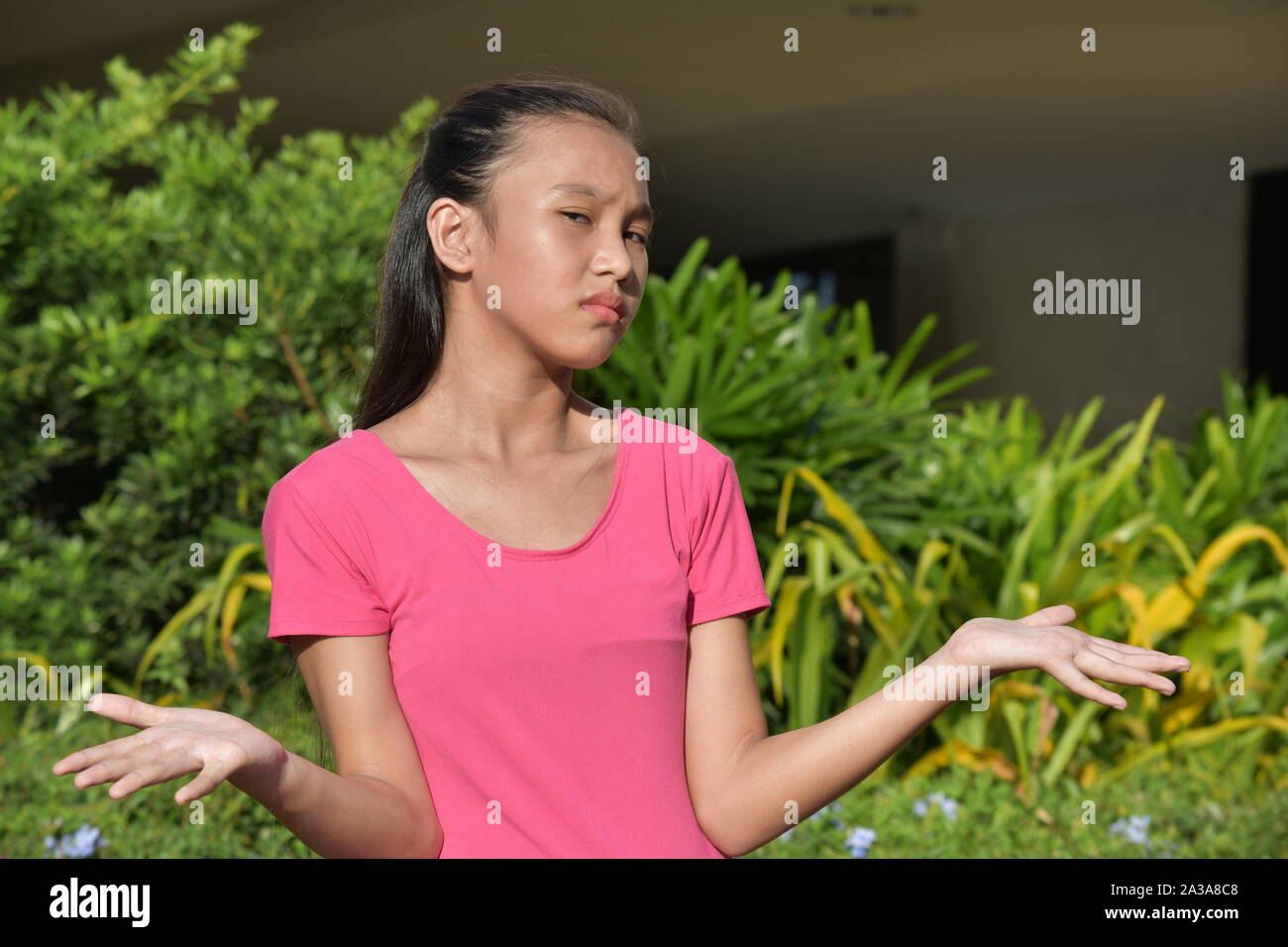 An Undecided Pretty Teenager Girl Stock Photo - Alamy