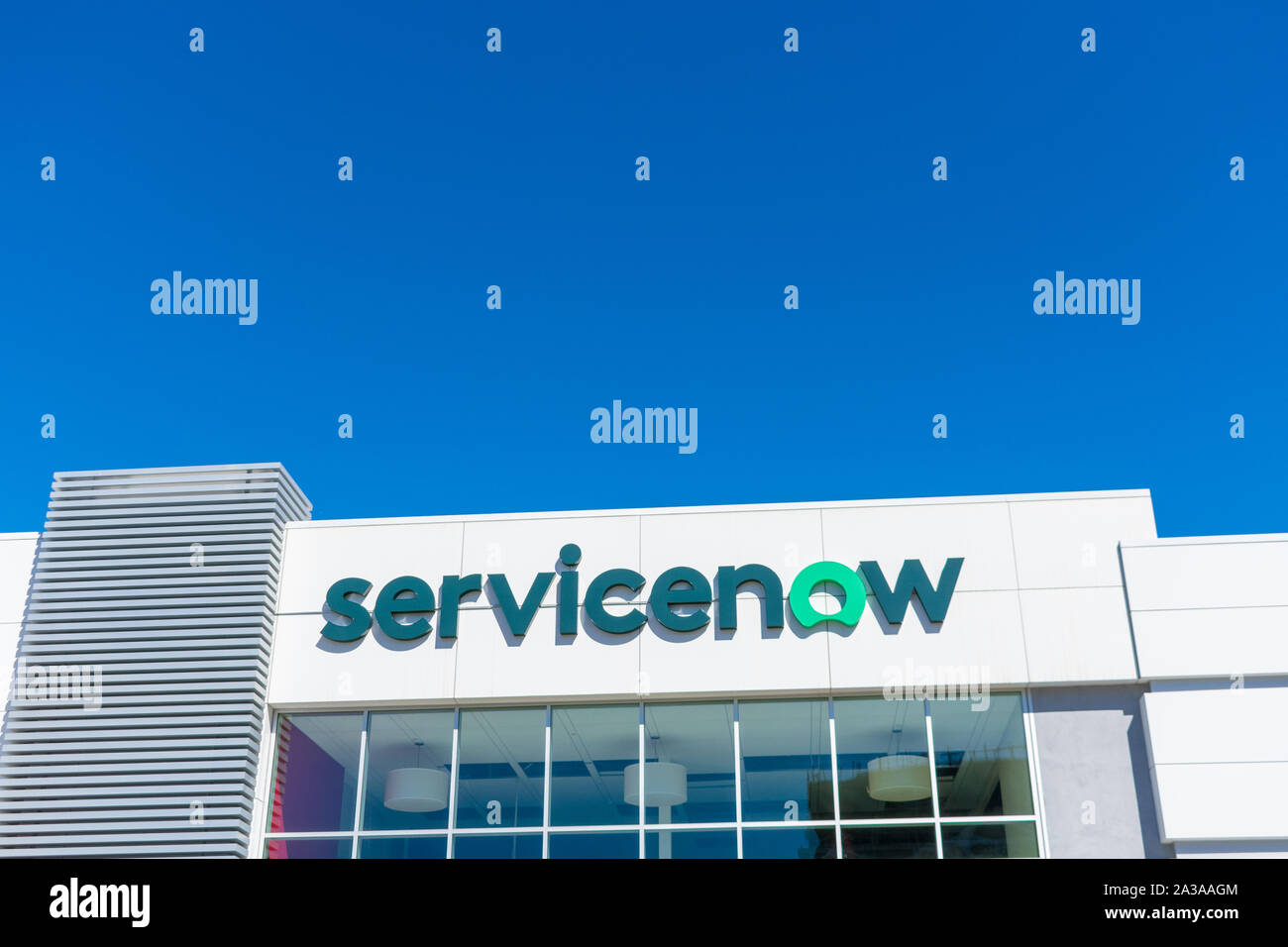ServiceNow logo atop of American cloud computing company global ...
