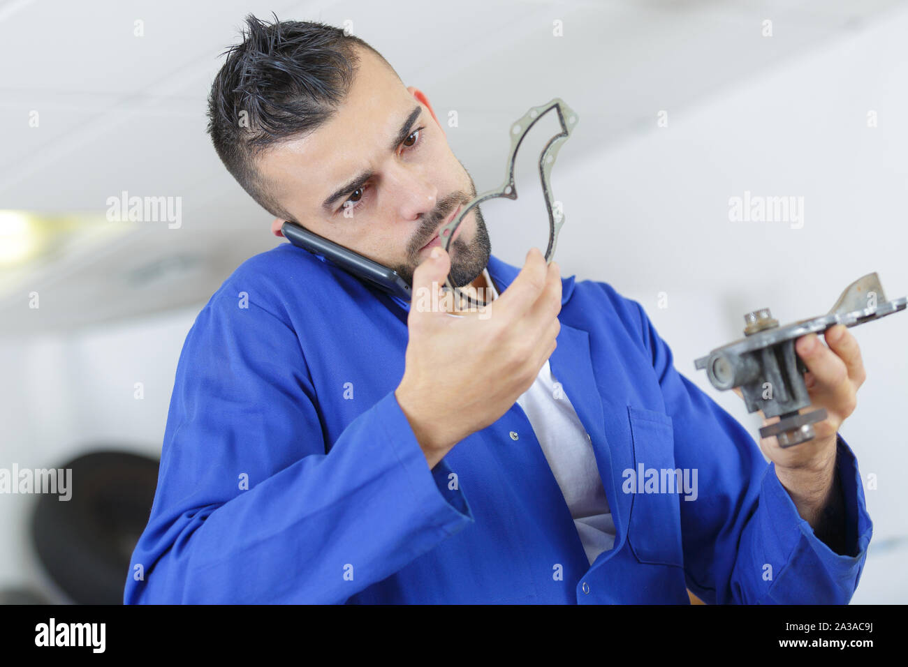 mechanic fixing a car at home Stock Photo - Alamy