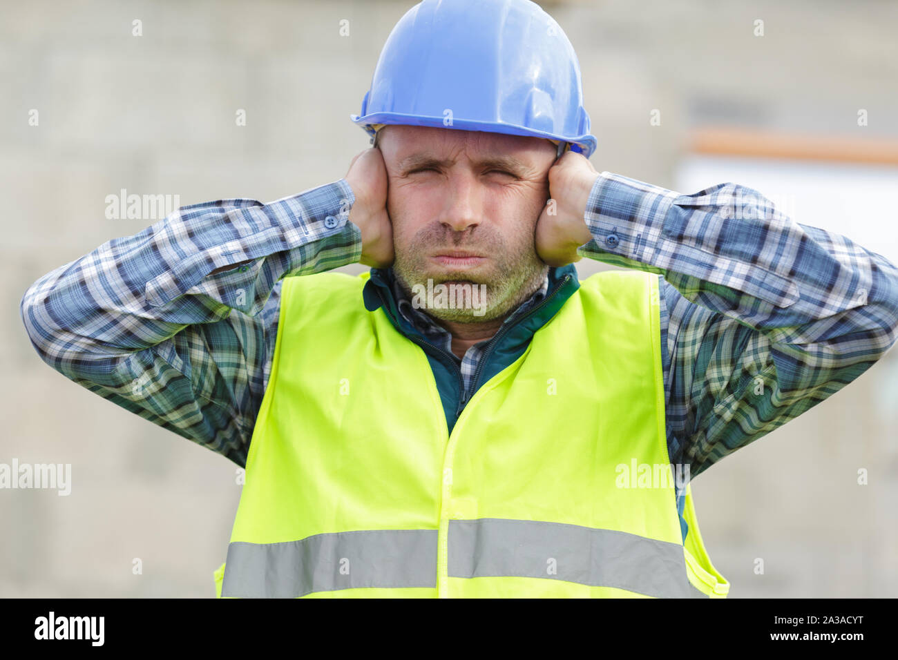 construction suffering from noise pollution on building site Stock ...