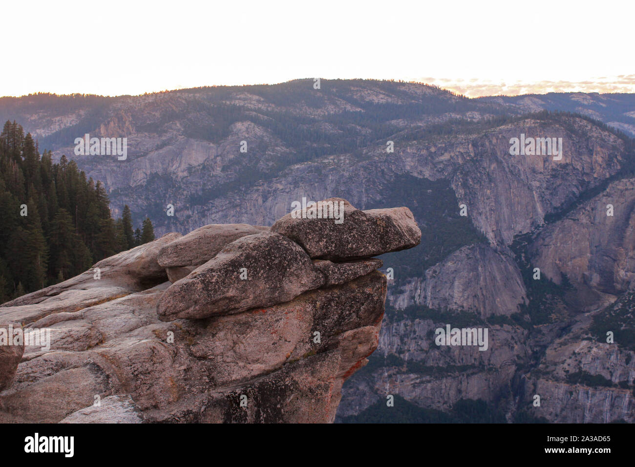 Overhanging rock with the view of famous Half Dome at Glacier Point ...