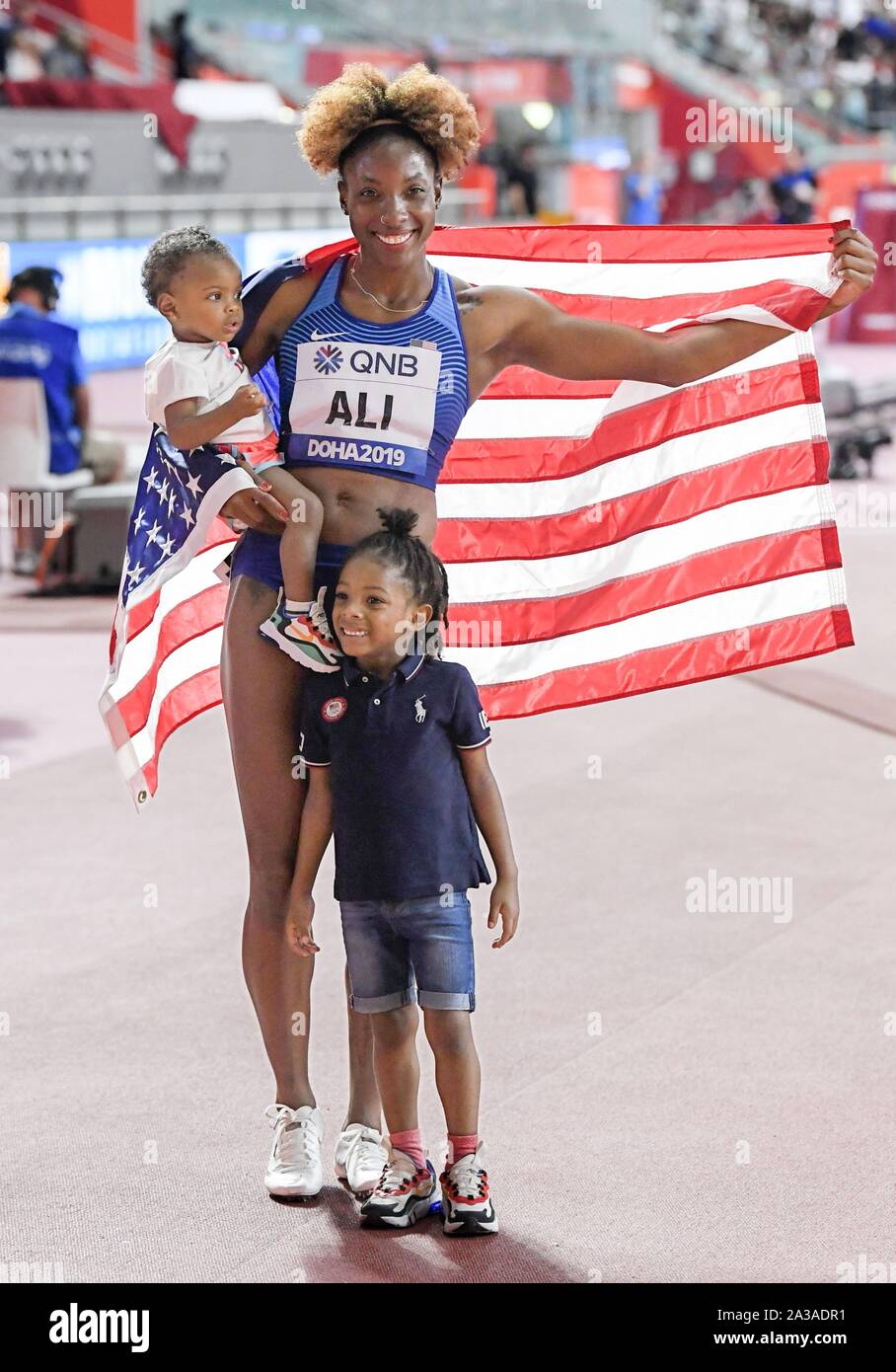 Nia Ali of the United States with her children after winning the women ...