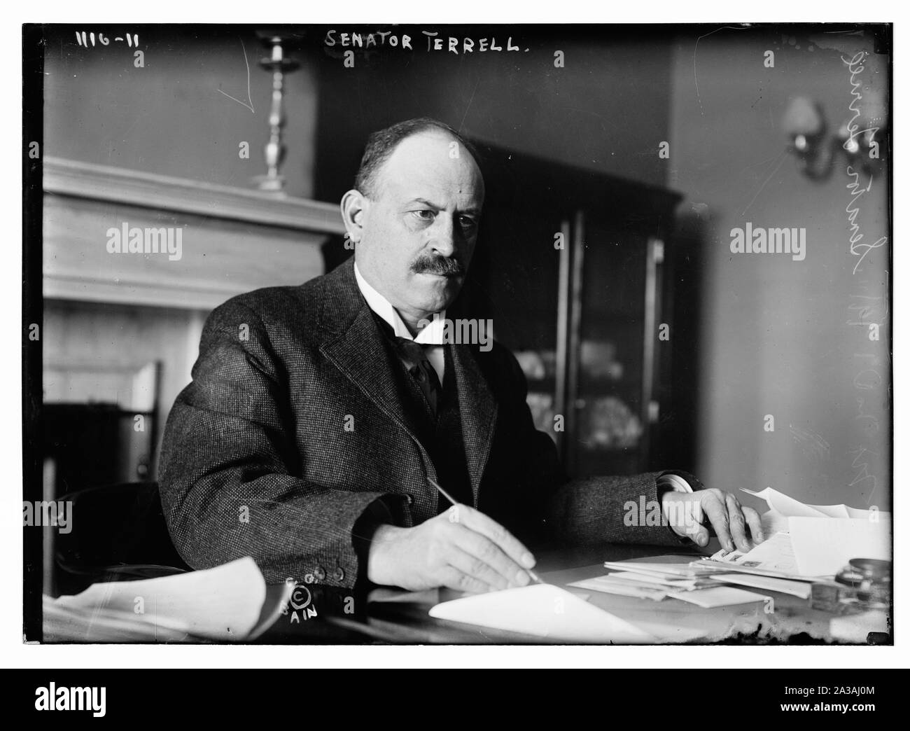 Senator Terrell writing at desk Stock Photo - Alamy