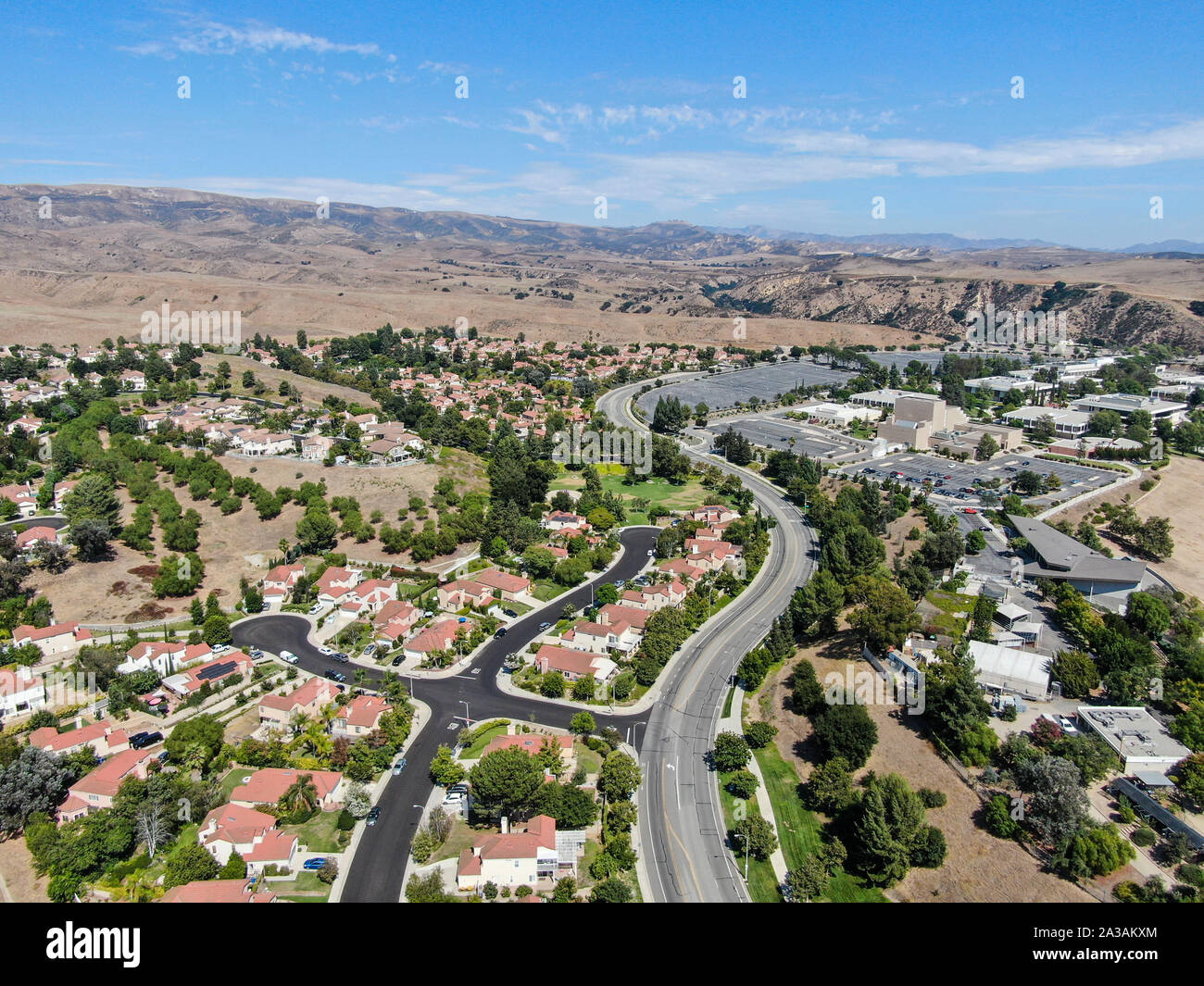 Aerial view of small neighborhood with dry desert mountain on the ...