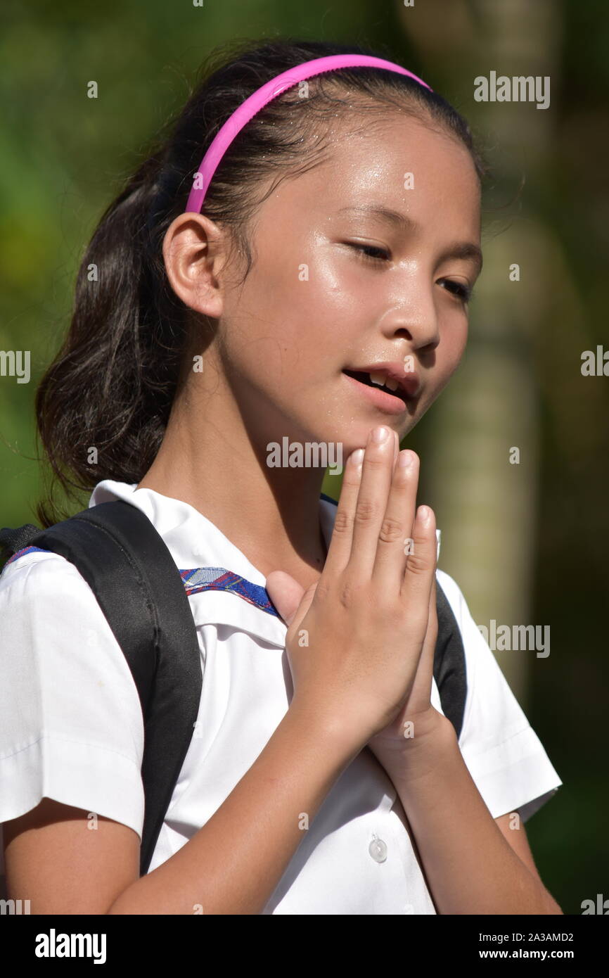 A Girl Student Praying Stock Photo - Alamy