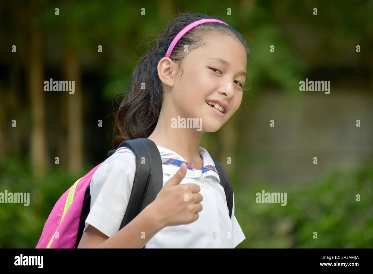 Happy Cute Filipina Female Student With Books Stock Photo - Alamy