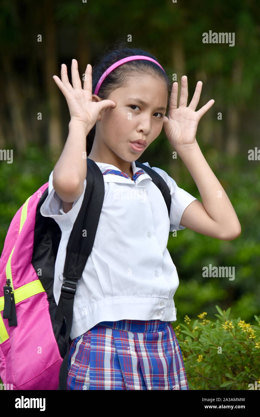 Pretty Asian Female Student Making Funny Faces With Notebooks Stock ...