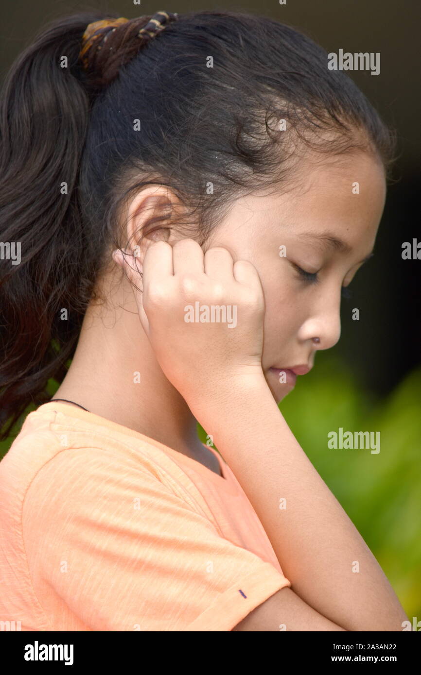 A Sad Young Filipina Girl Stock Photo - Alamy