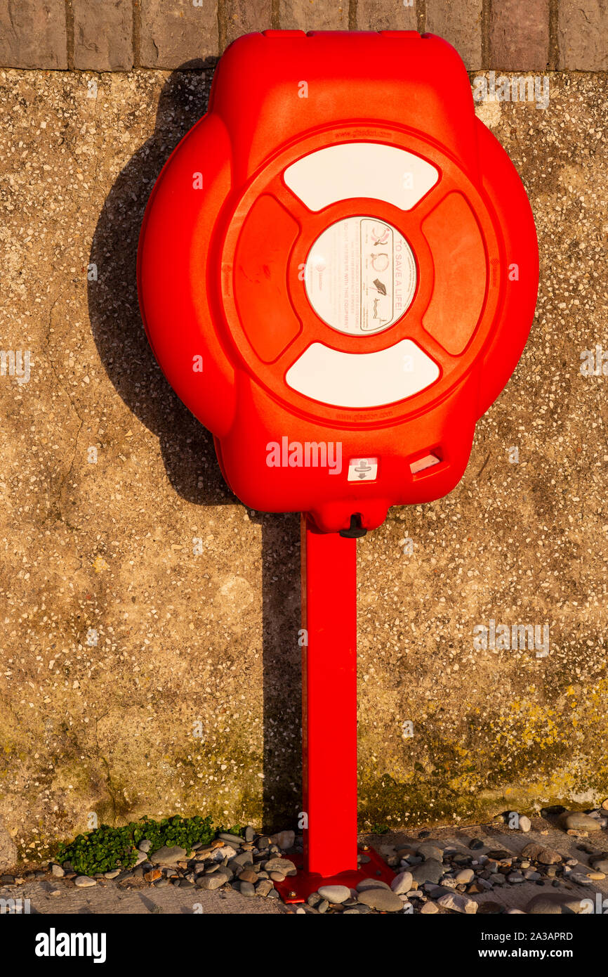 Red lifebelt at Deganwy on the North Wales coast Stock Photo - Alamy