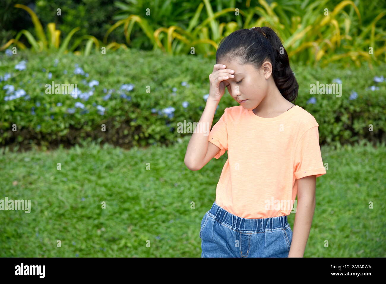 An A Worrisome Filipina Person Stock Photo - Alamy