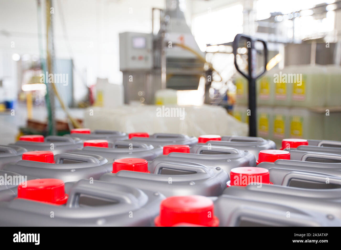 Plastic containers with lids on the background of chemical production ...