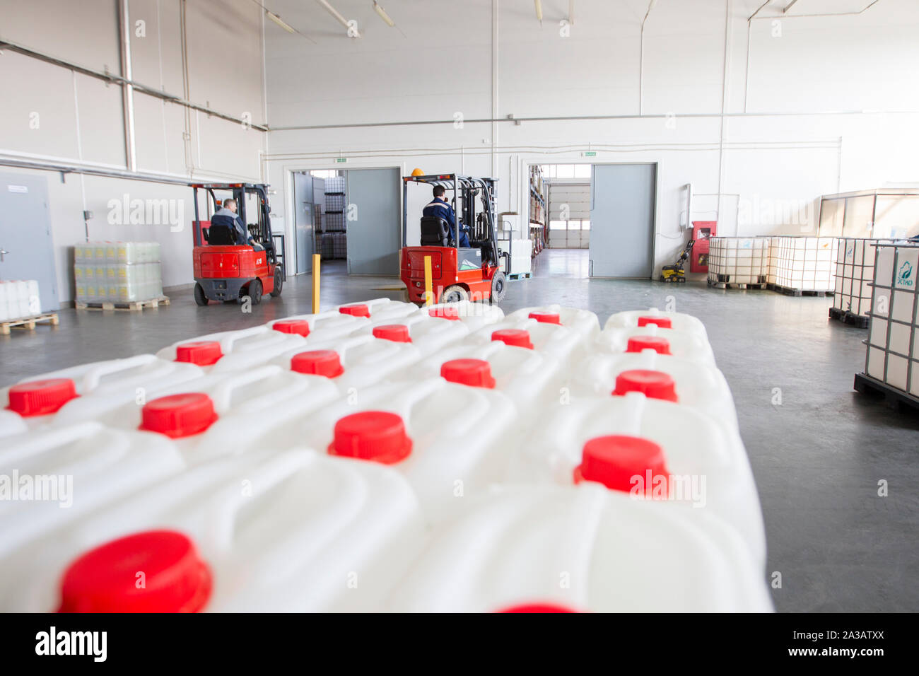 Plastic containers with lids on the background of chemical production ...