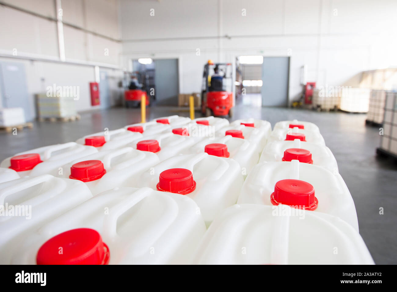 Plastic containers with lids on the background of chemical production ...