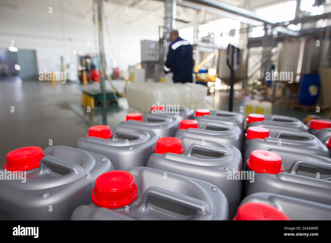Plastic containers with lids on the background of chemical production ...