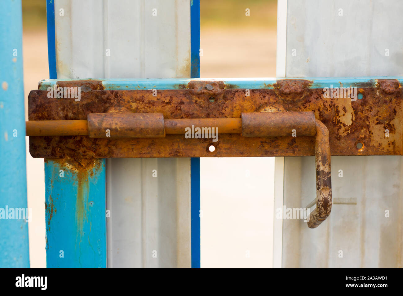 A rusty old bolt on the metal doors Stock Photo - Alamy