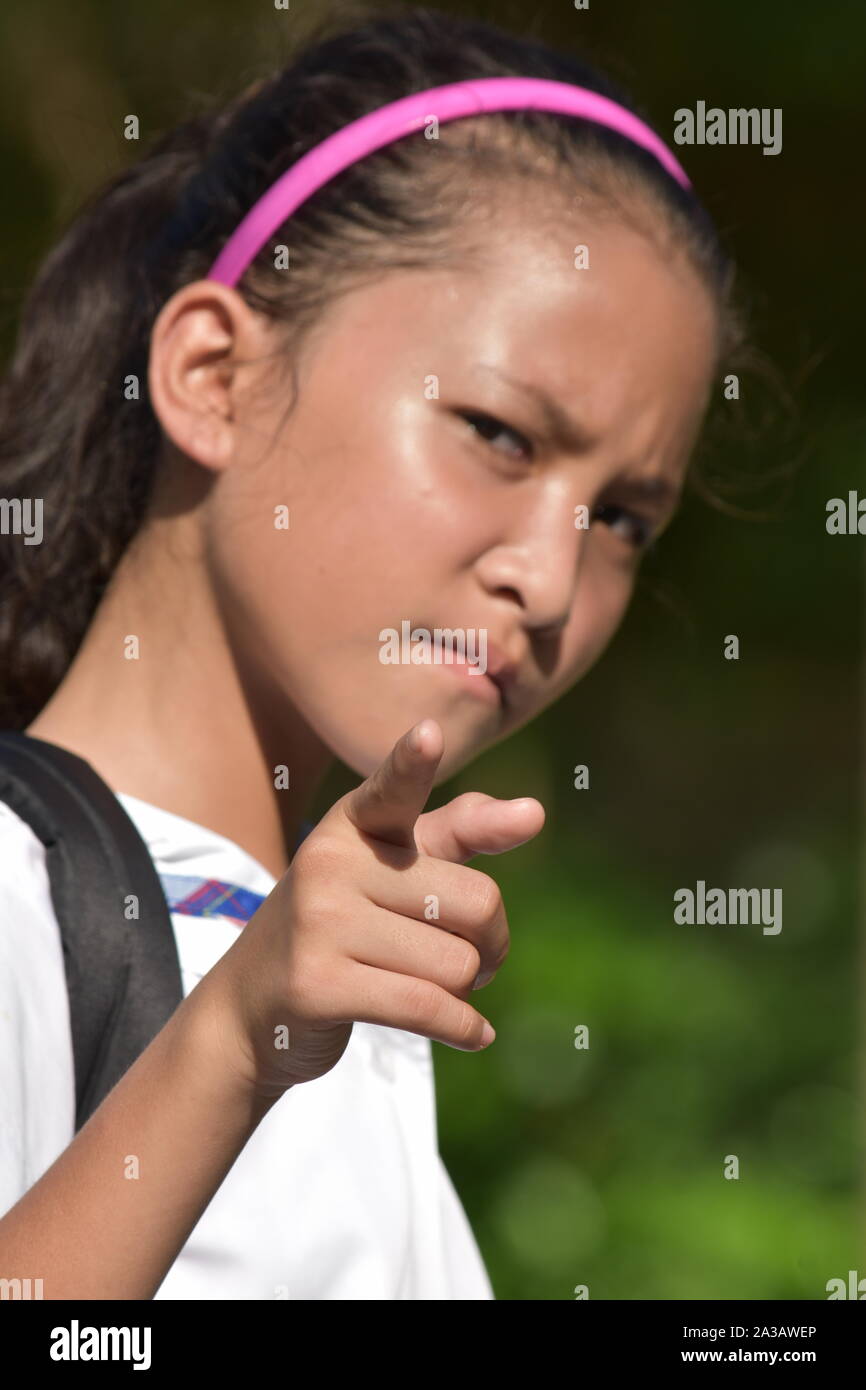A Girl Student Pointing With Notebooks Stock Photo - Alamy