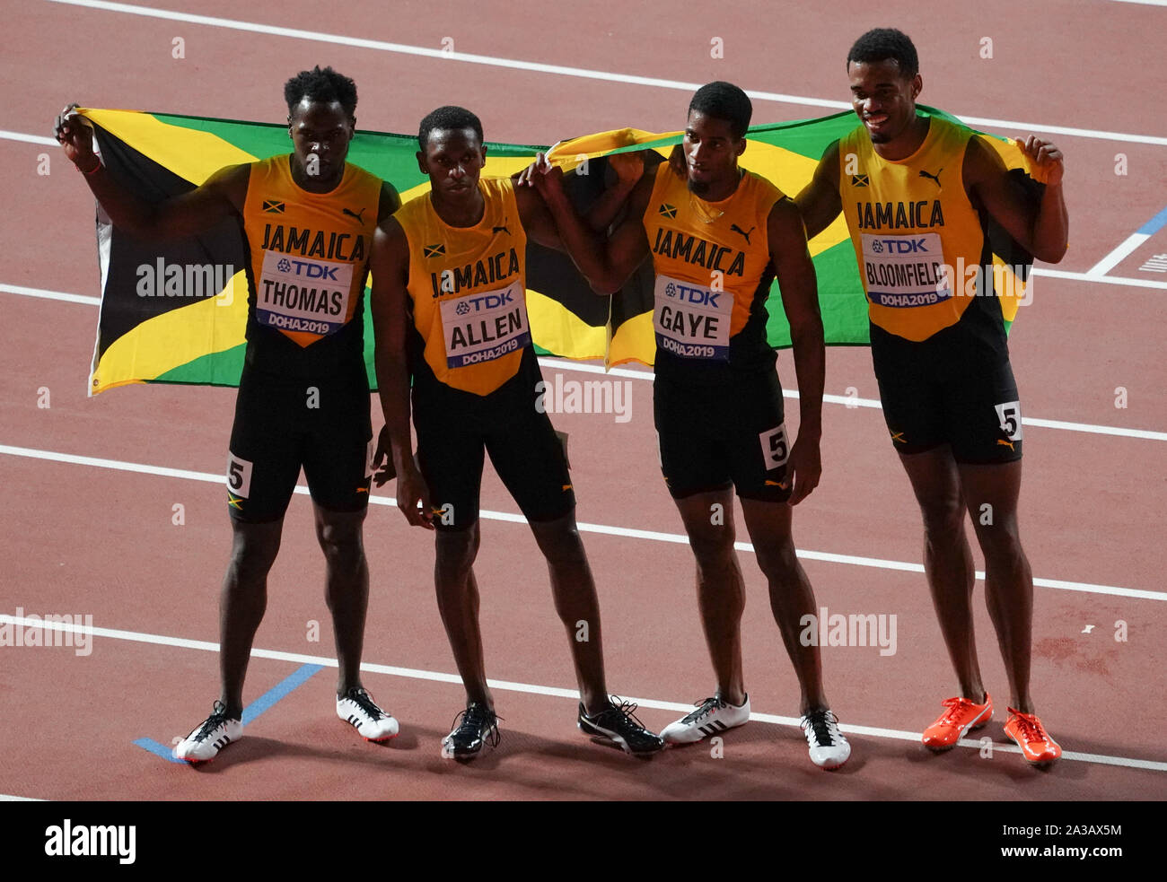 Doha, Qatar. 6th Oct, 2019. Team Jamaica celebrate winning the silver medals after the men's ...